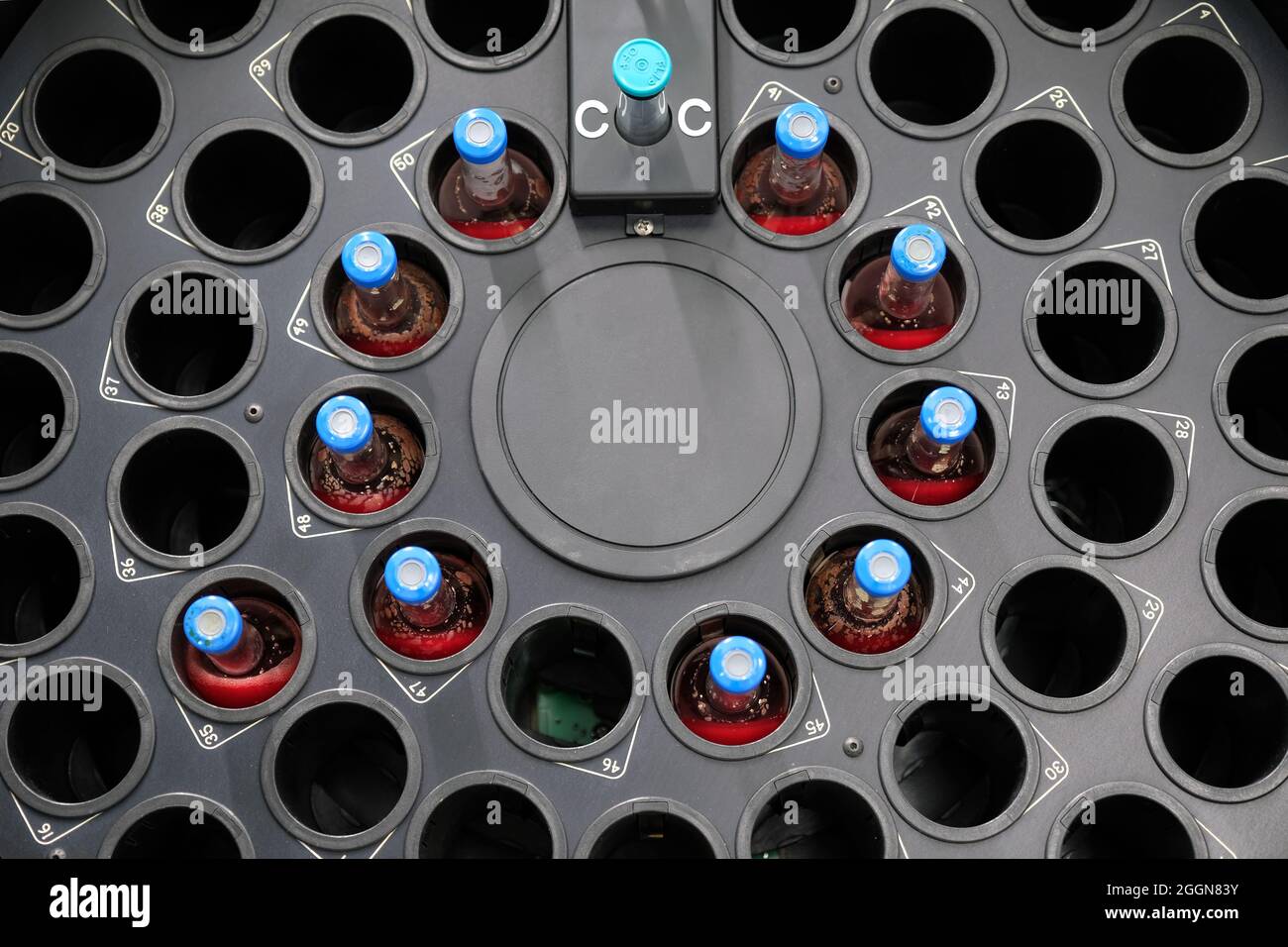 Culture bottles containing liquid media and human blood or body fluid ...