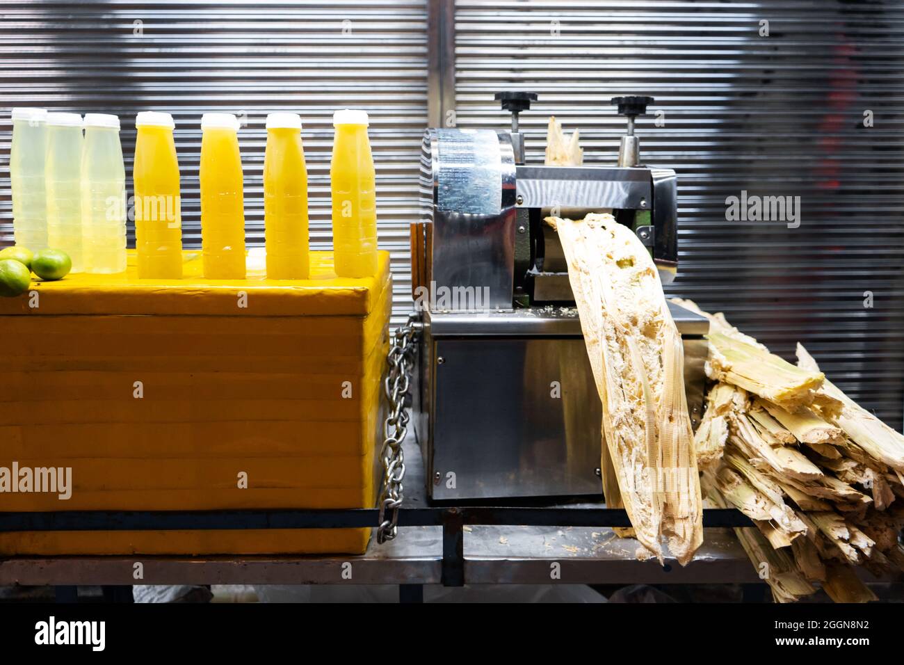 Cane making juice machine at the bar Stock Photo - Alamy