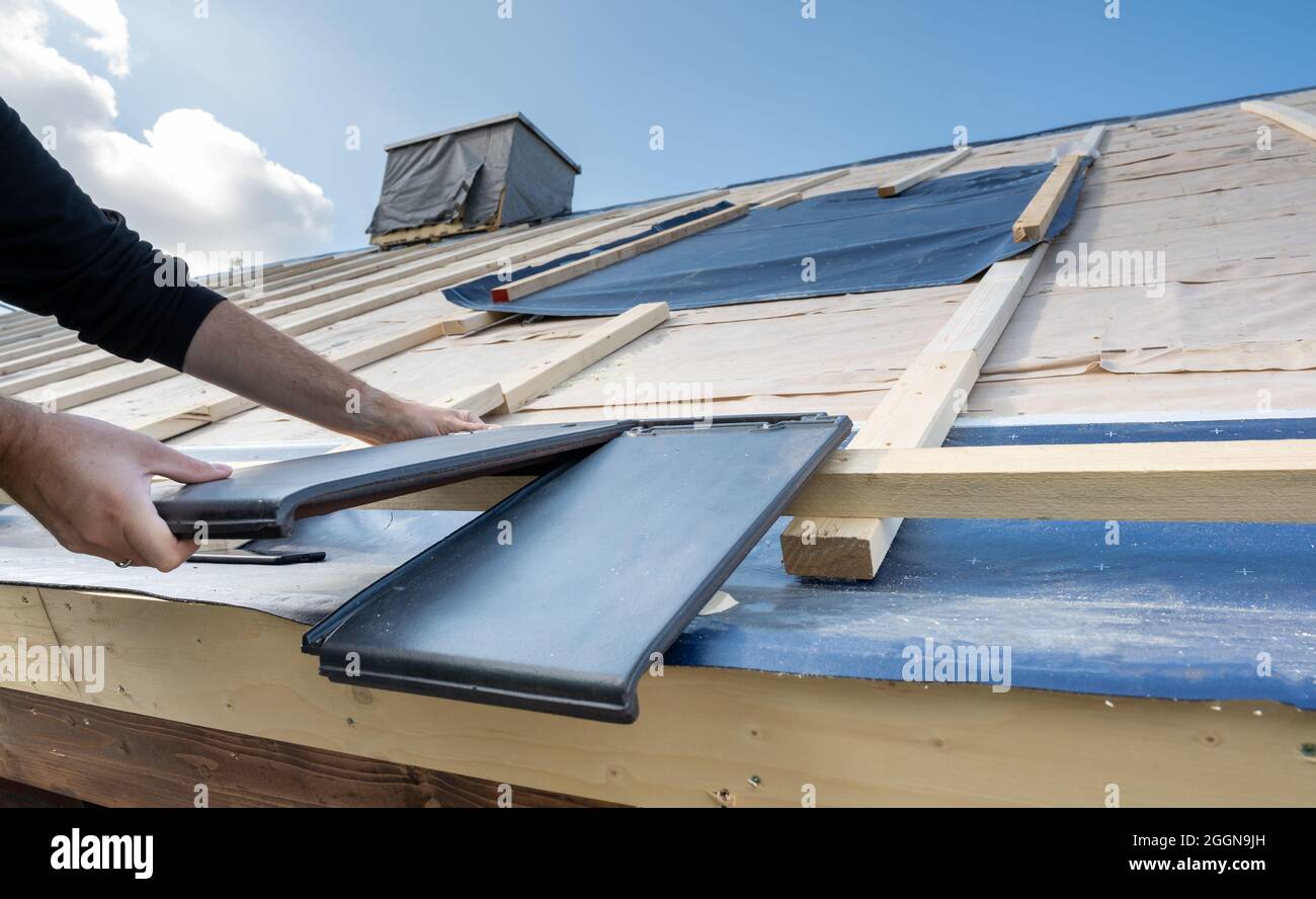 Putting on a roof hi-res stock photography and images - Alamy