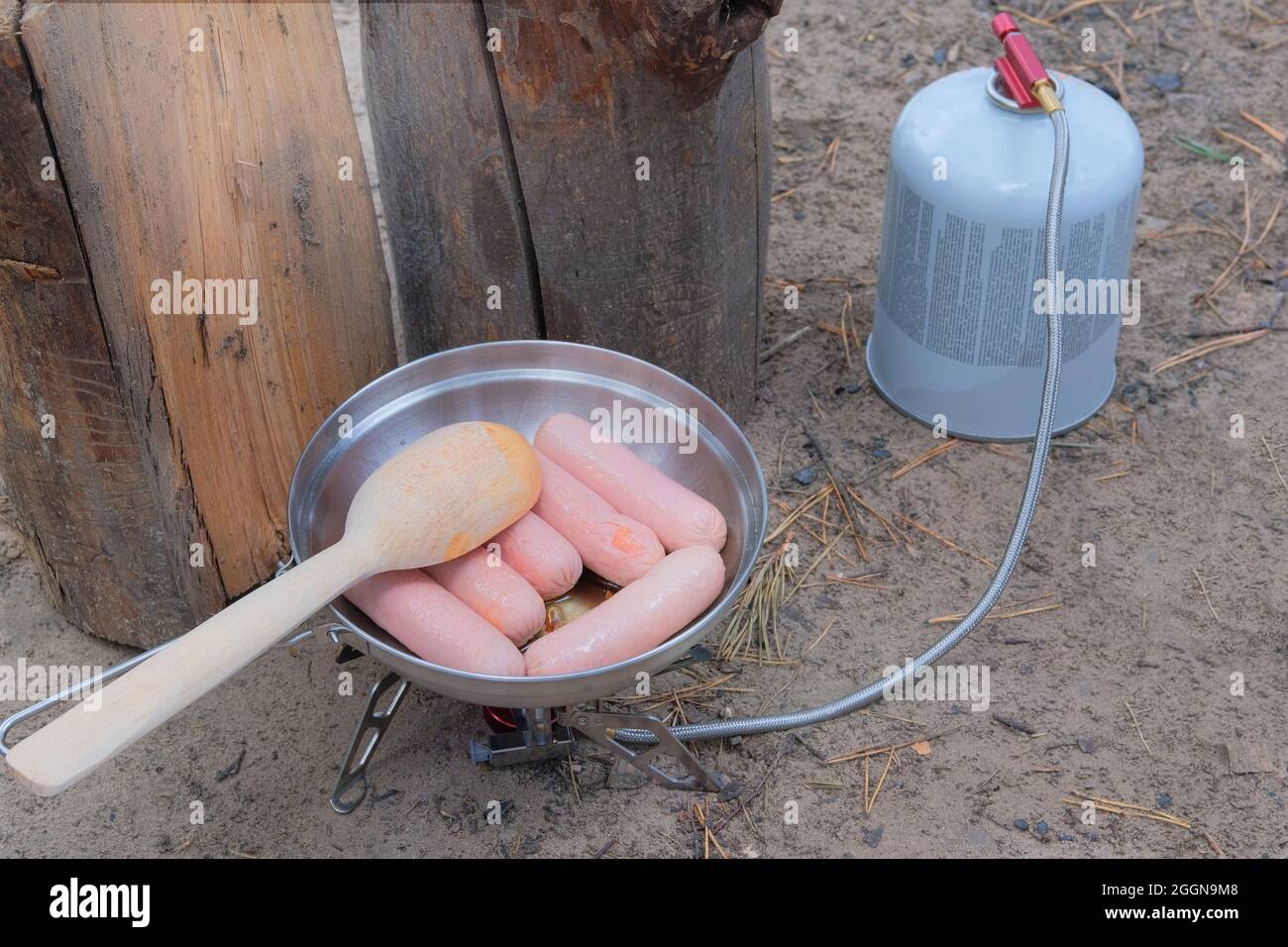 Camping food making. Traveler foods for outdoor activities. Sausages in ...
