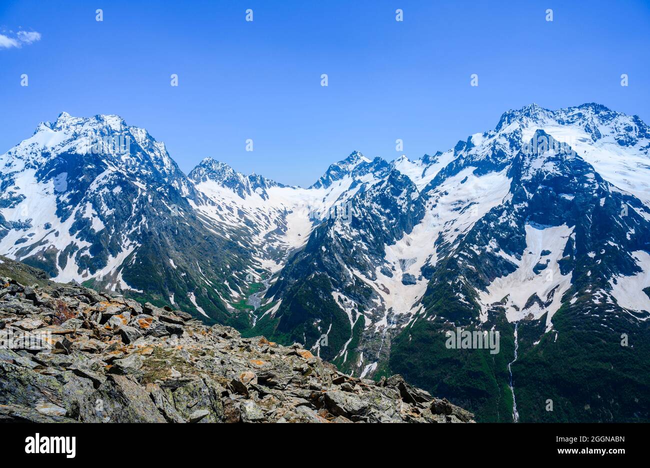 Sharp peaks of the Dombay Mountains covered with snow Stock Photo - Alamy
