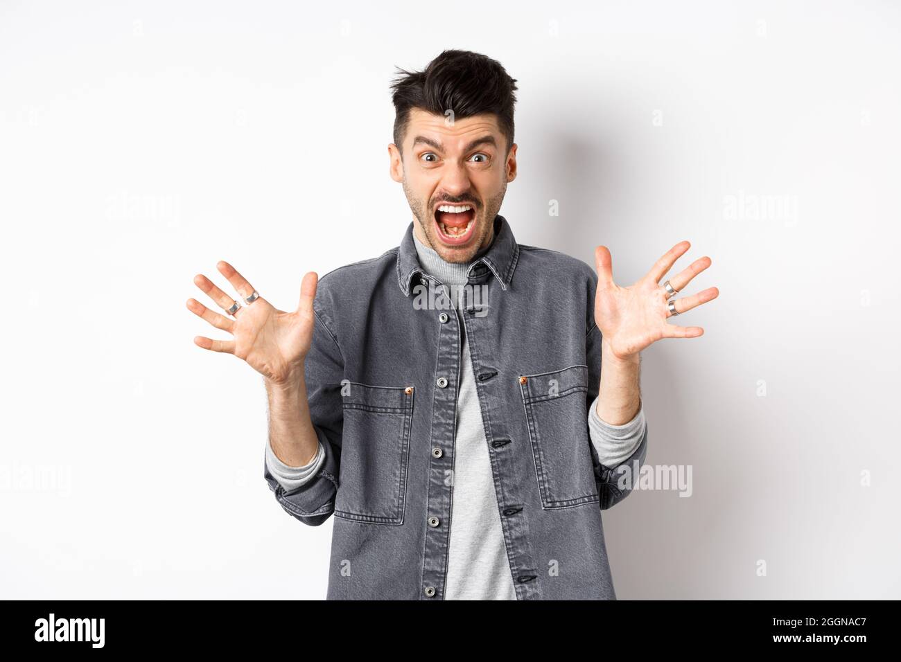 Angry man scream and look scary at camera, shouting with furious and ...