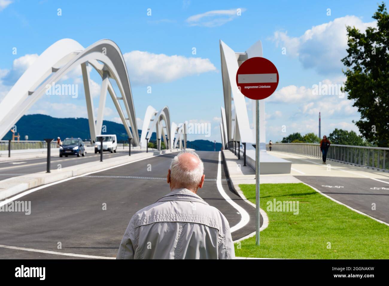 linz, austria, 01 sep 2021, old man watching the new bridge over the ...