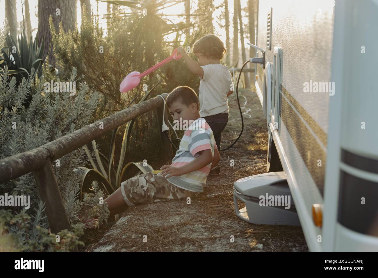 Two Boys In A Caravan playing in the nature Stock Photo - Alamy