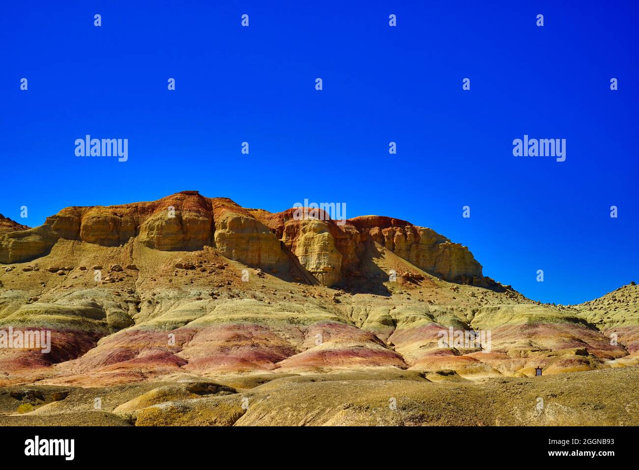 Wind eroded square hills, minarets, peaks, Efege mounds. Clean blue sky ...