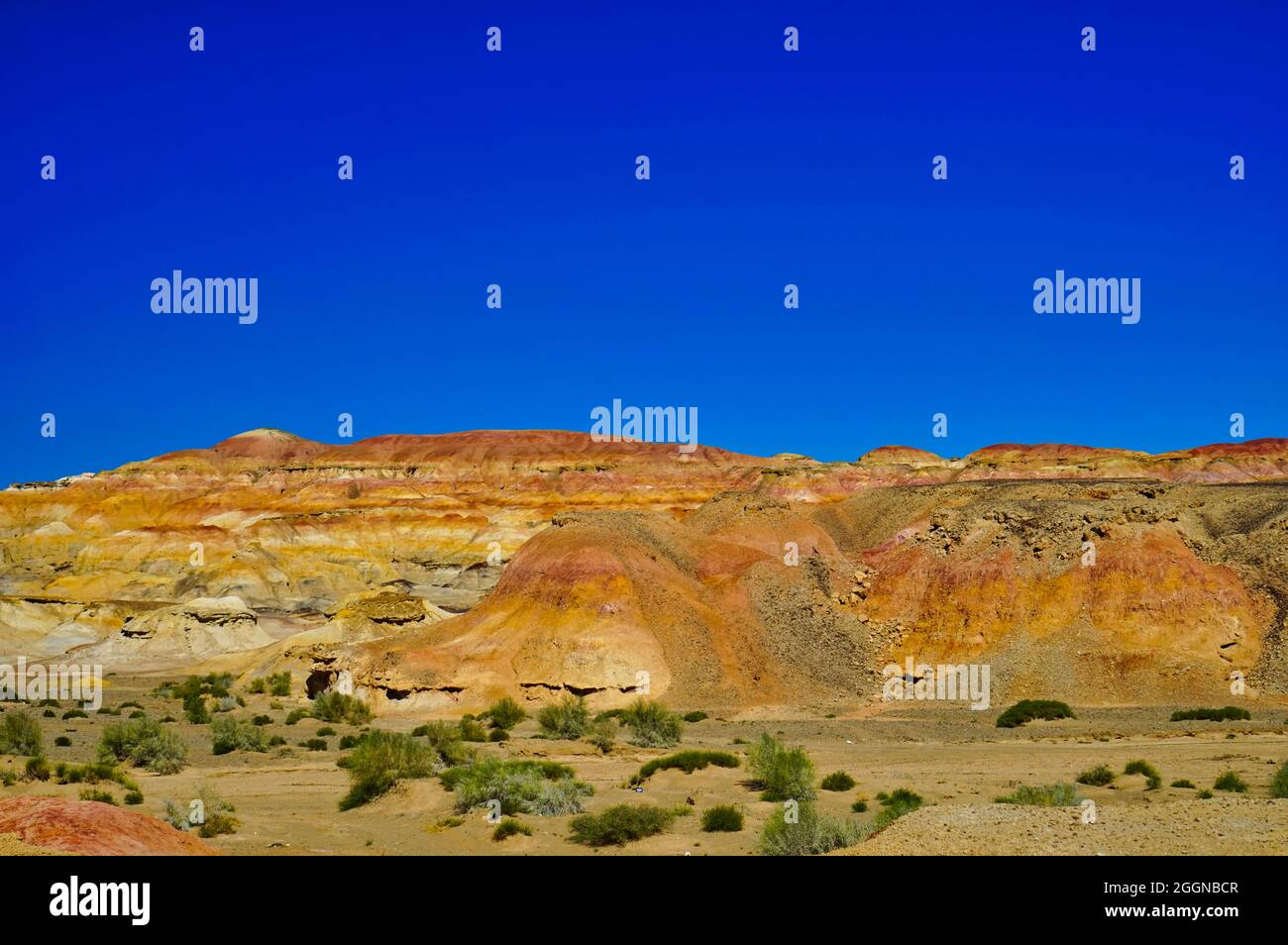 Wind eroded square hills, minarets, peaks, Efege mounds. Clean blue sky ...