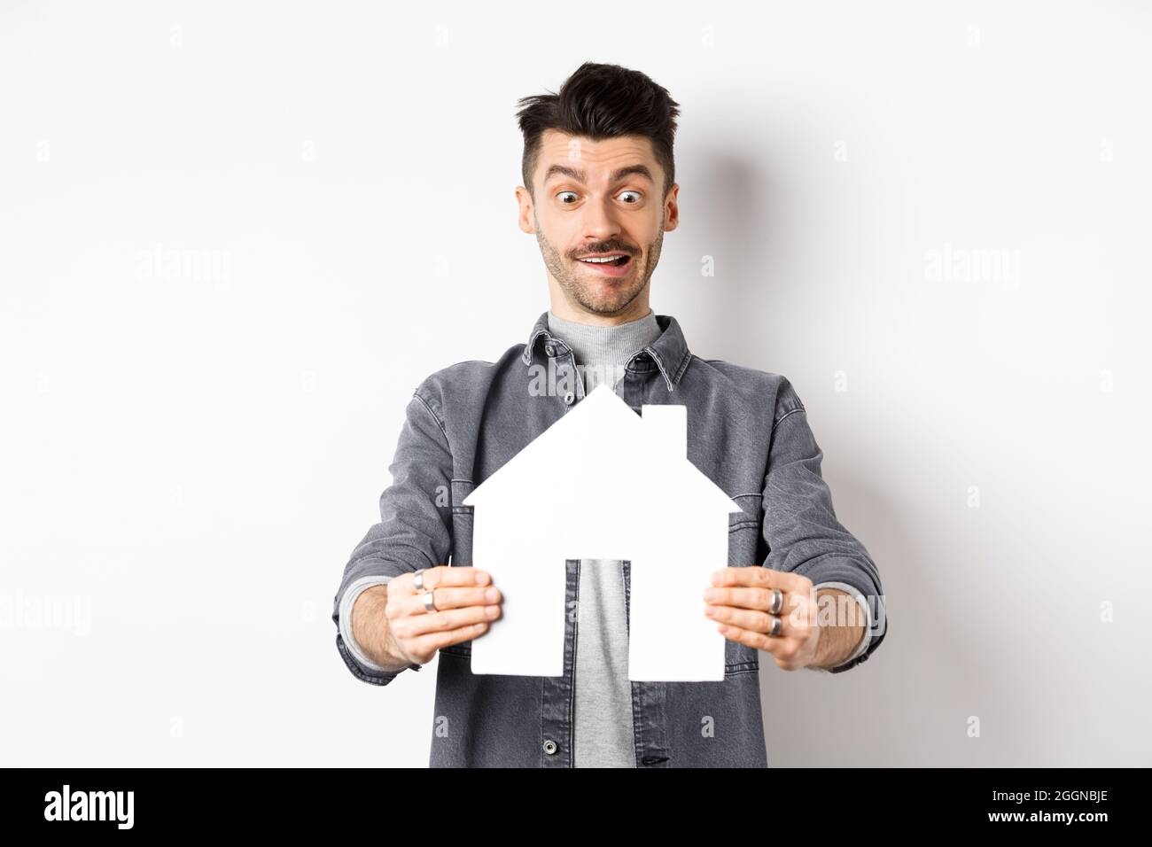 Real estate and insurance concept. Man look with excitement at paper ...