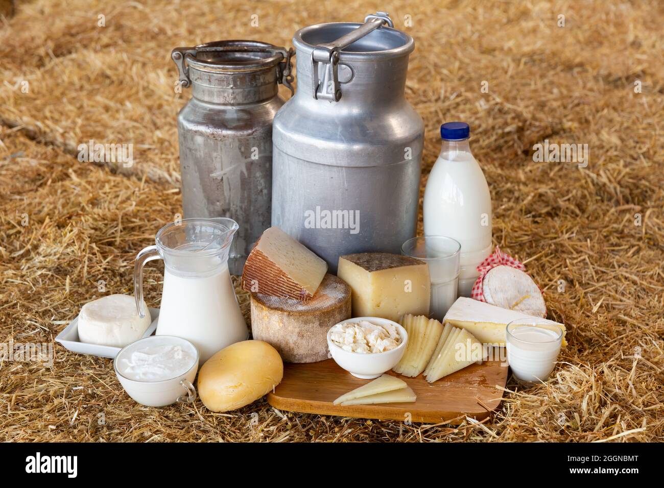 Composition of dairy products on hay bales Stock Photo - Alamy