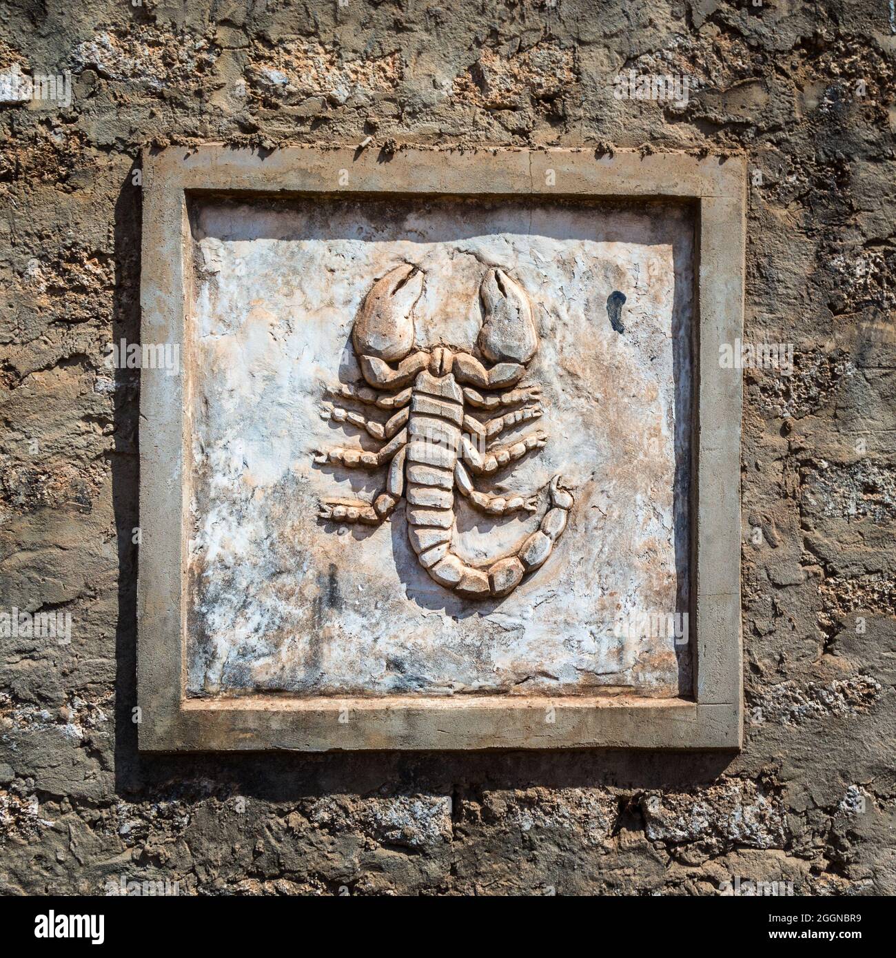 Closeup shot of a scorpion sign carved on stone Stock Photo - Alamy