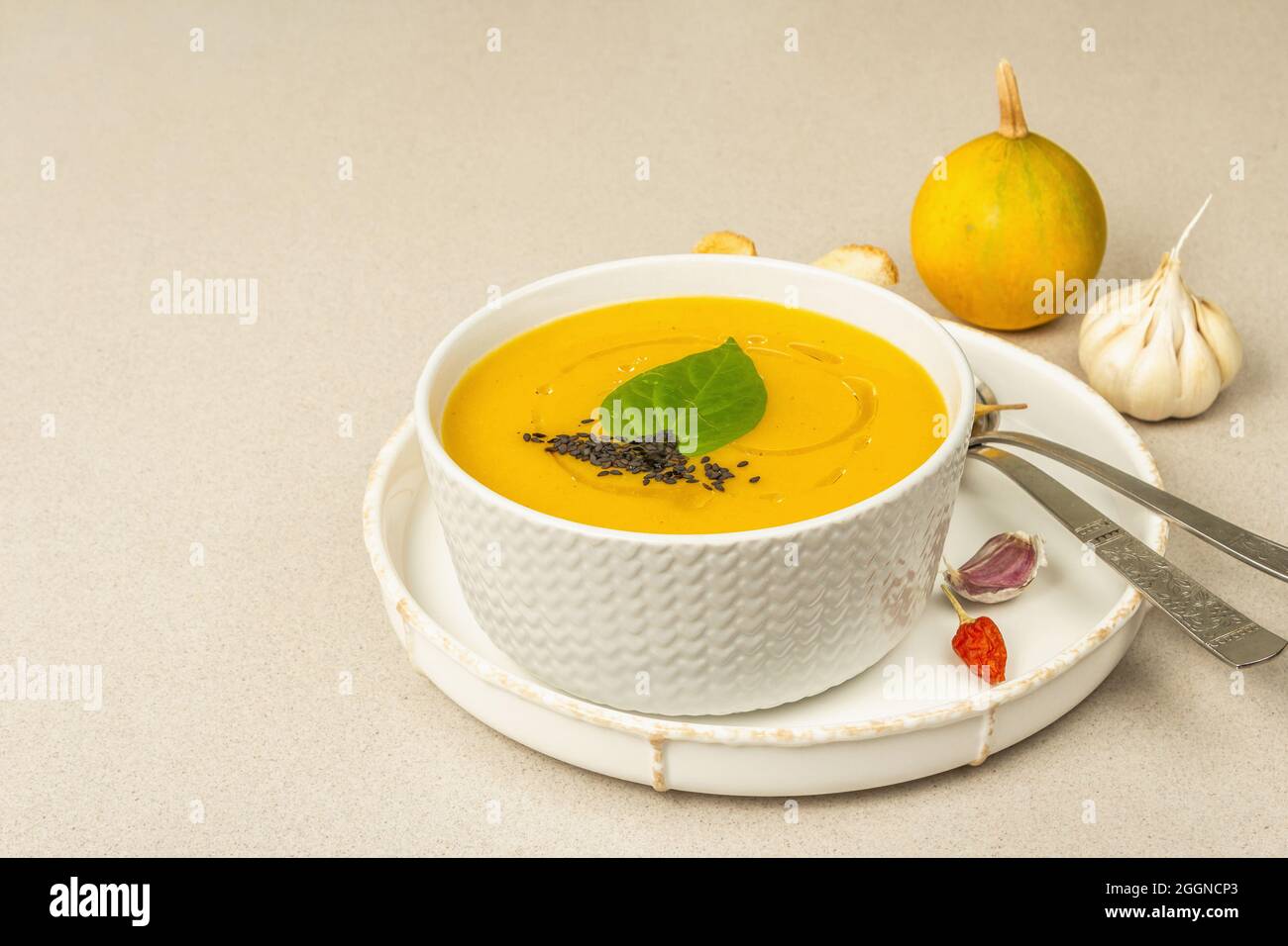 Pumpkin cream soup. Traditional autumn food. Hot dish, ripe vegetables ...