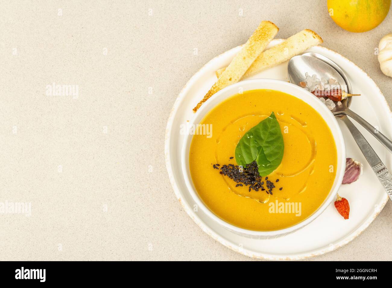 Pumpkin cream soup. Traditional autumn food. Hot dish, ripe vegetables ...