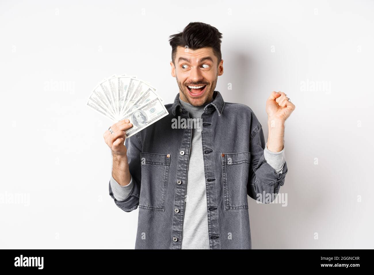 Lucky man winning prize money and scream of excitement, staring at ...