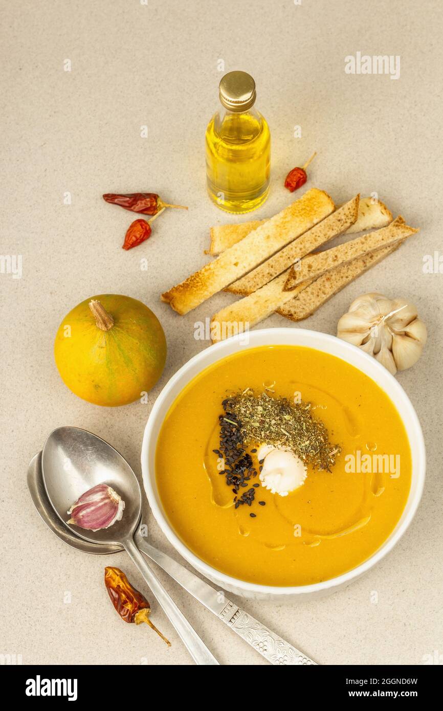 Pumpkin cream soup. Traditional autumn food. Hot dish, ripe vegetables ...