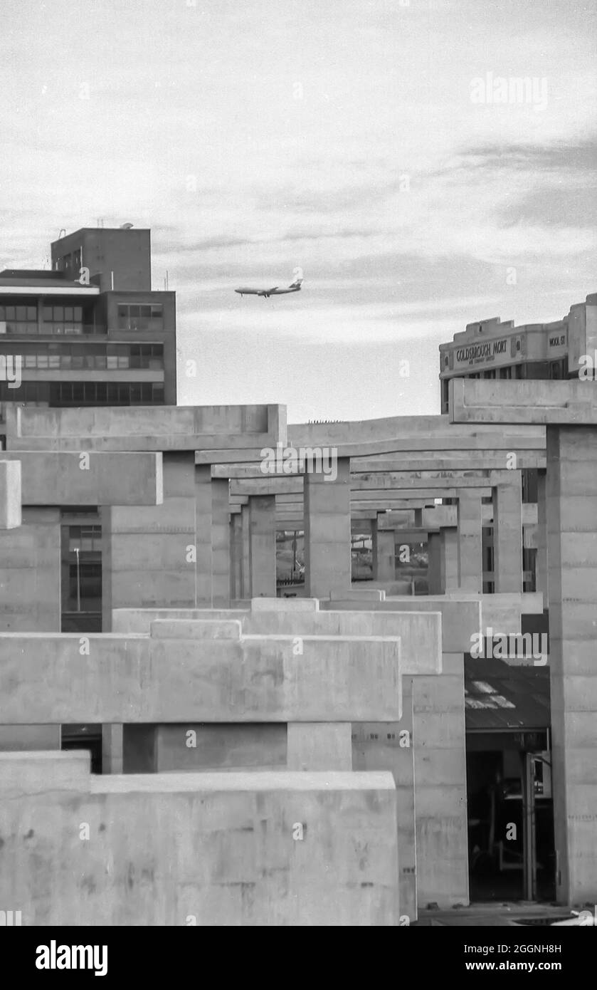 A 1970's image of a Qantas 747 flying over concrete pillars ready to ...
