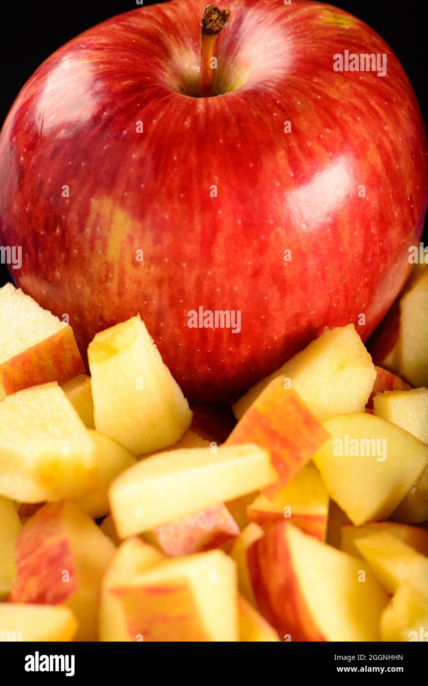 whole red apple with small pieces Stock Photo - Alamy