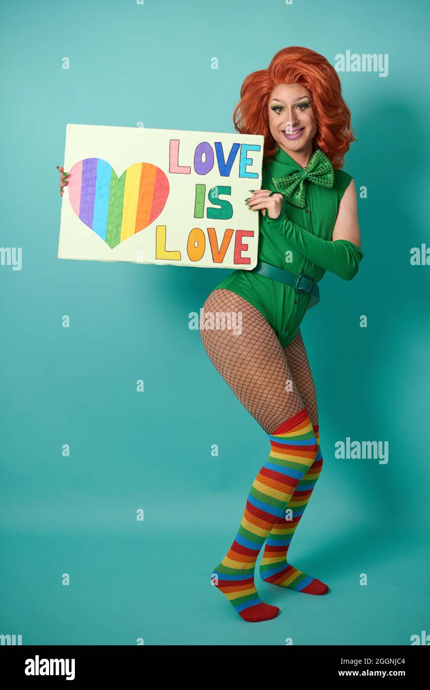 Friendly transgender person showing banner Stock Photo - Alamy