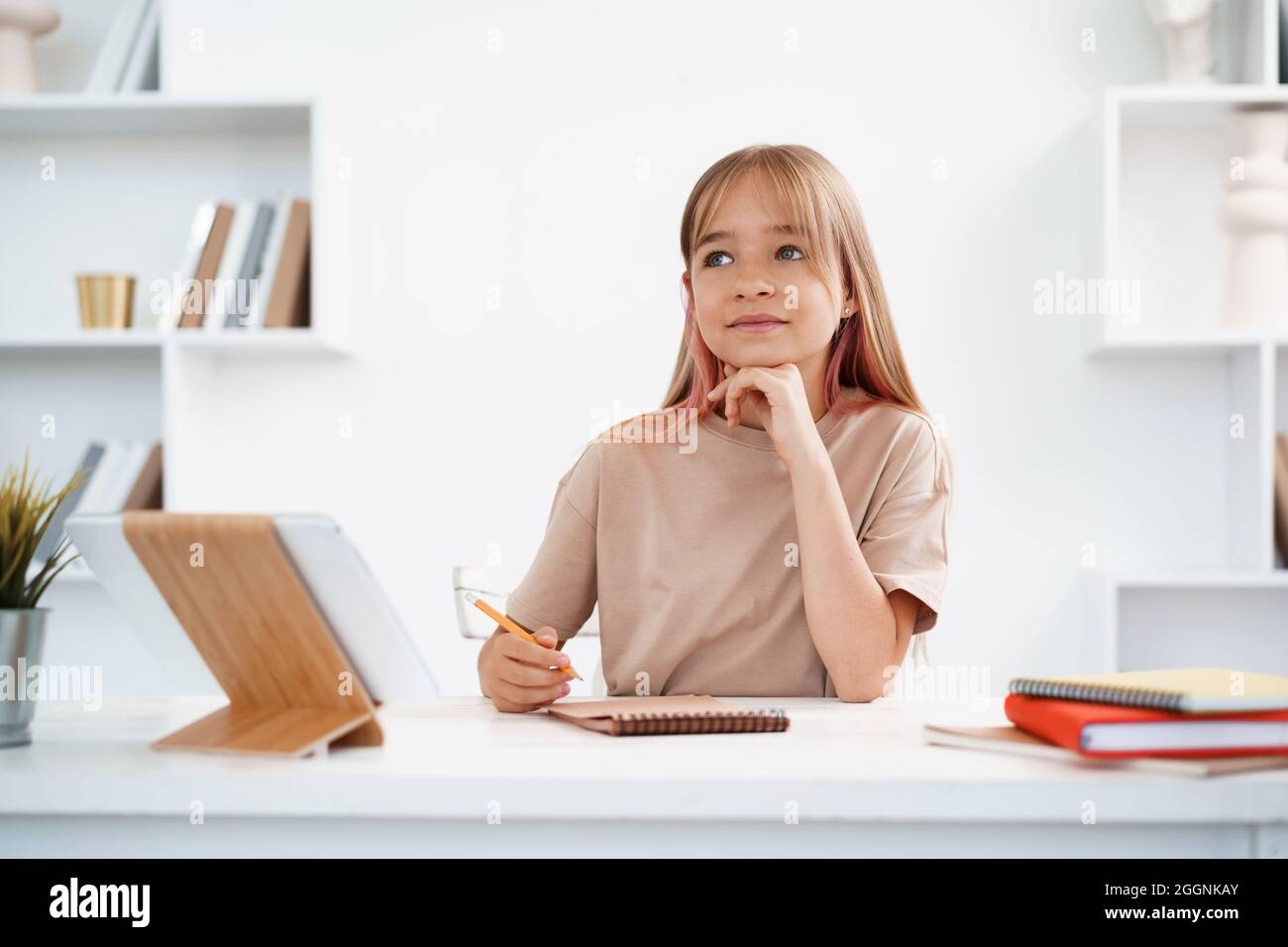 Portrait of a little girl using digital tablet computer at home Stock ...
