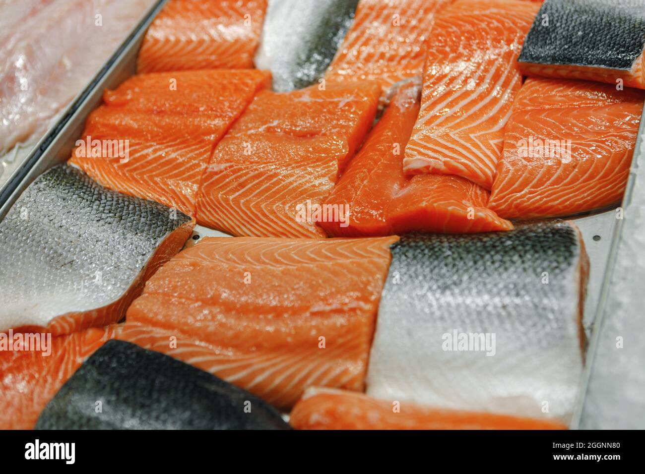 Fresh fish assorted on ice counter in supermarket Stock Photo - Alamy