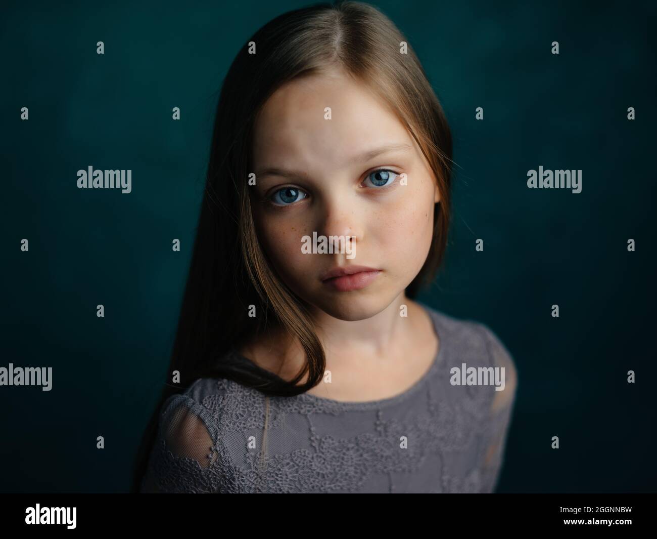 little girl long hair posing green background Stock Photo - Alamy