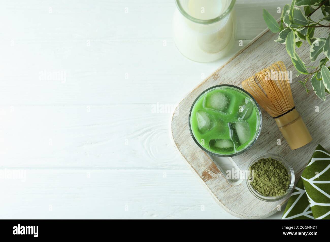 Matcha latte and accessories for making on white wooden table Stock ...