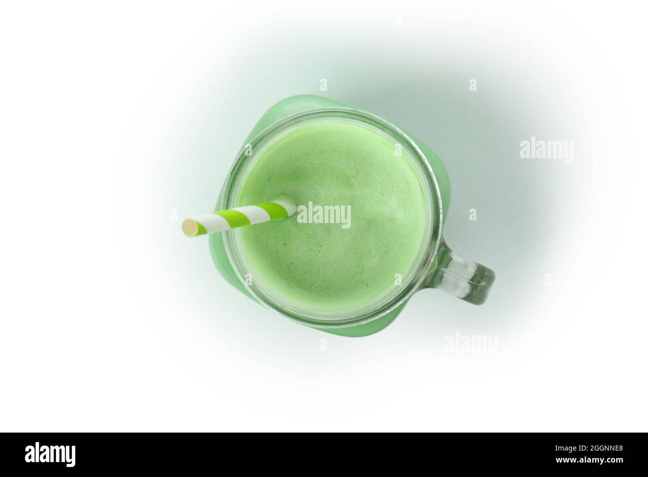 Glass jar of matcha latte isolated on white background Stock Photo - Alamy