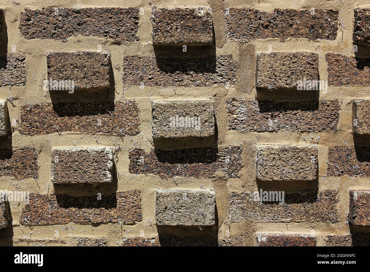 Fancy masonry brick wall standing in the bright summer sun Stock Photo ...