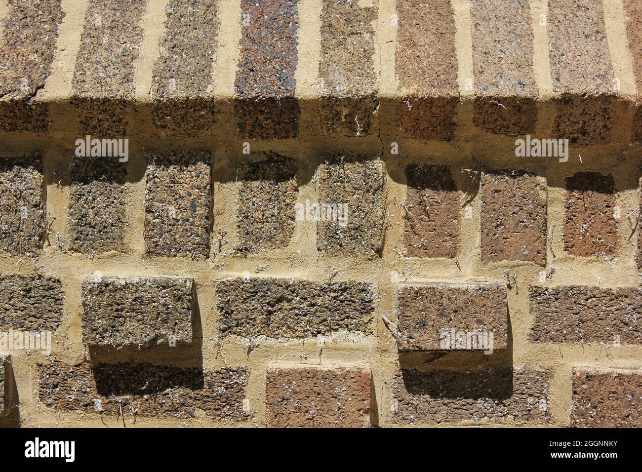 Fancy masonry brick wall standing in the bright summer sun Stock Photo ...