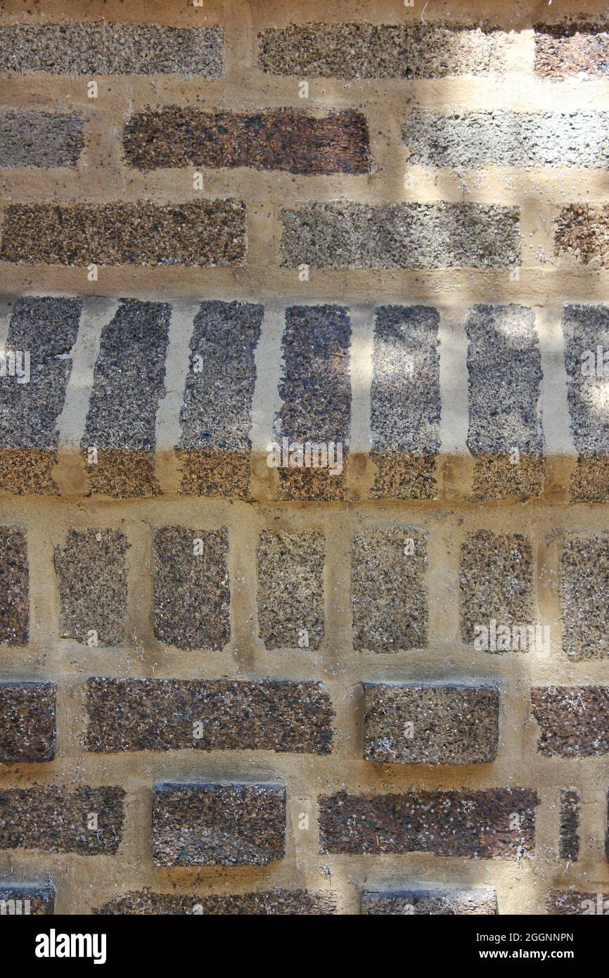 Fancy masonry brick wall standing in the bright summer sun Stock Photo ...