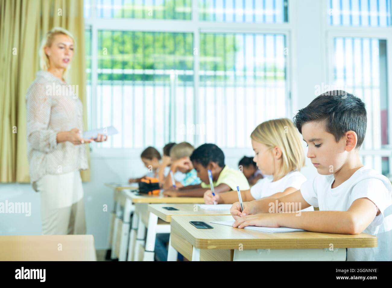 Side view of group of elementary school students Stock Photo - Alamy