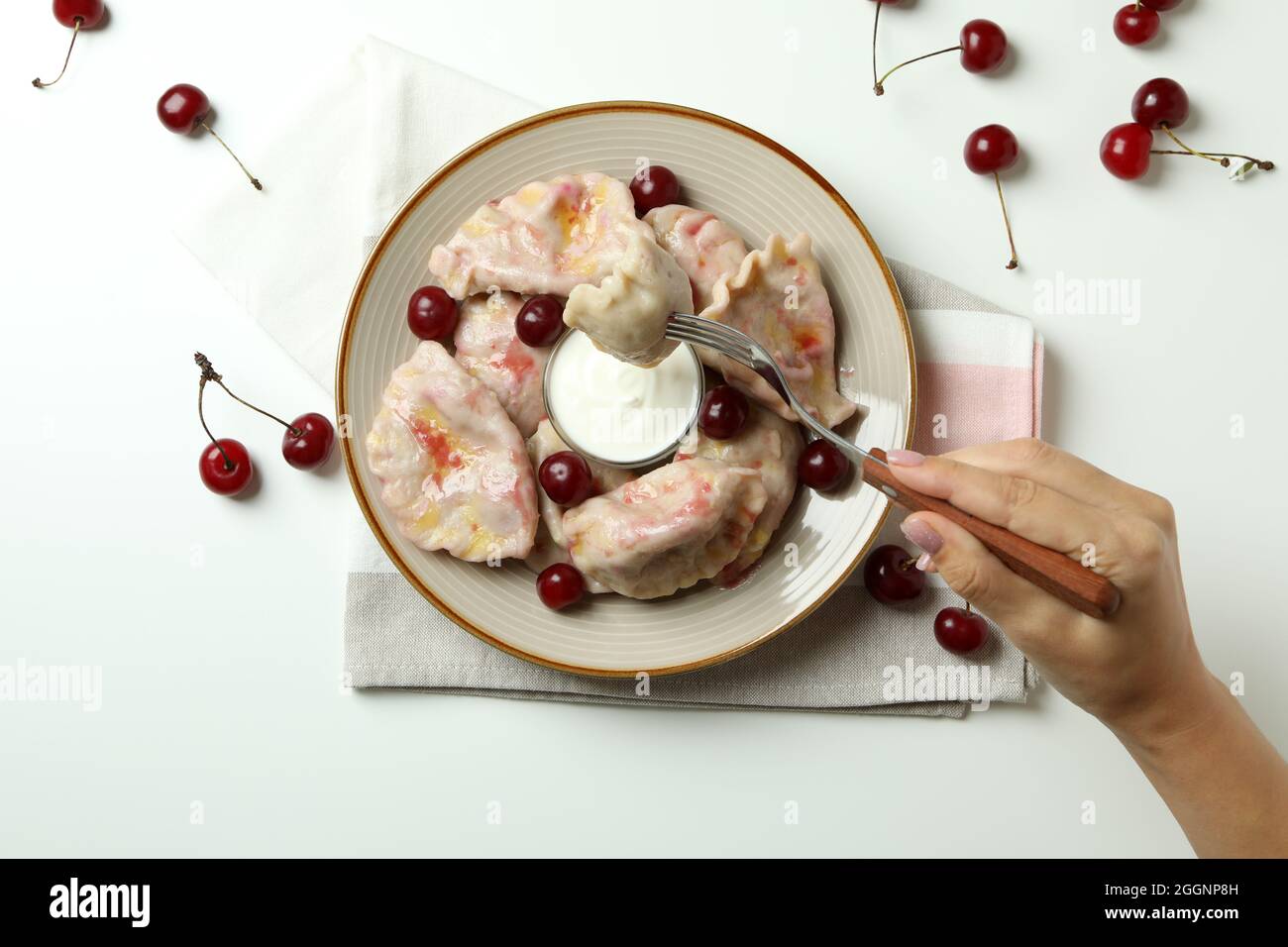 Concept of tasty eating with pierogi with cherry Stock Photo - Alamy
