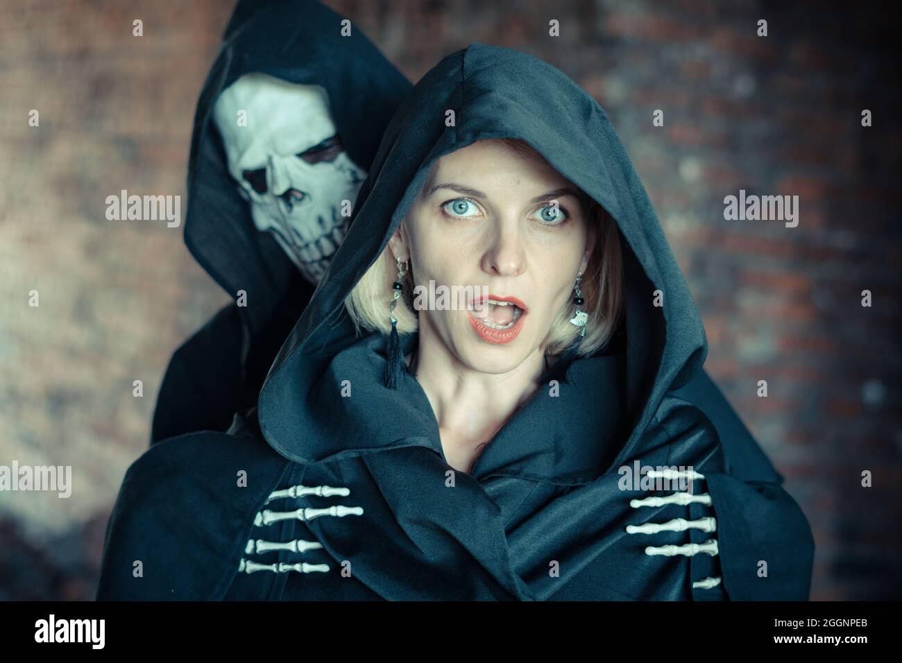 the girl and death in the cloak Stock Photo - Alamy