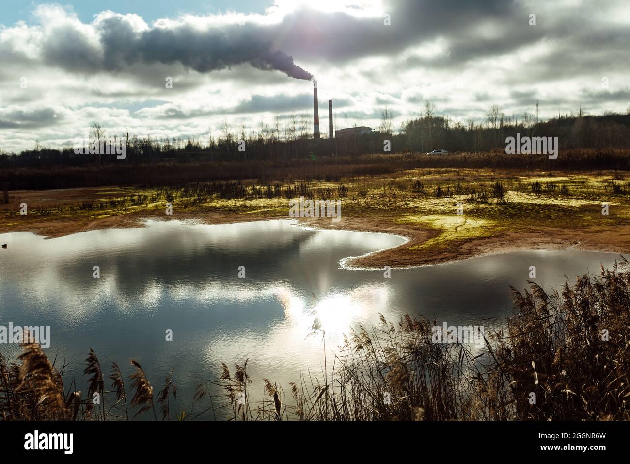 the pipes of the thermal power plant smoke on the horizon. country ...