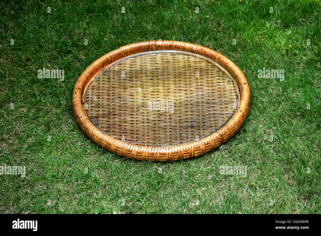 rattan cane tray with outdoor blurry background color light brown ...