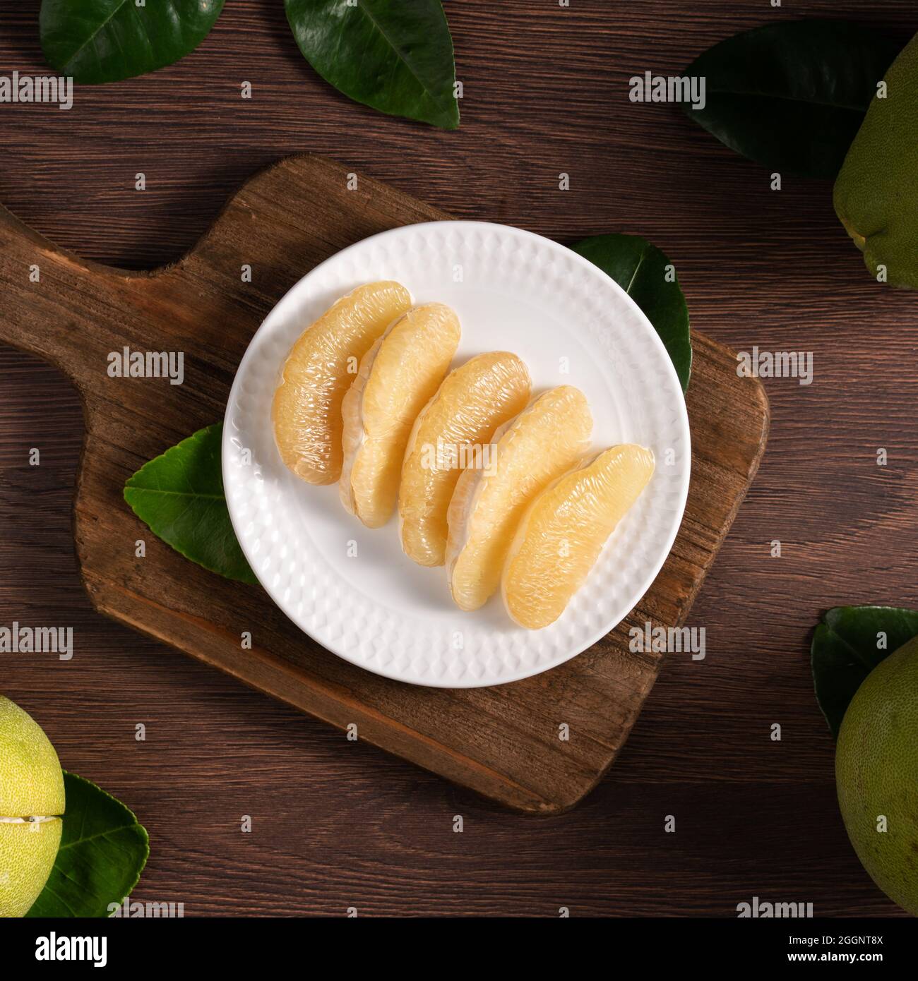 Top view of fresh pomelo on dark wooden table background for Mid-Autumn ...