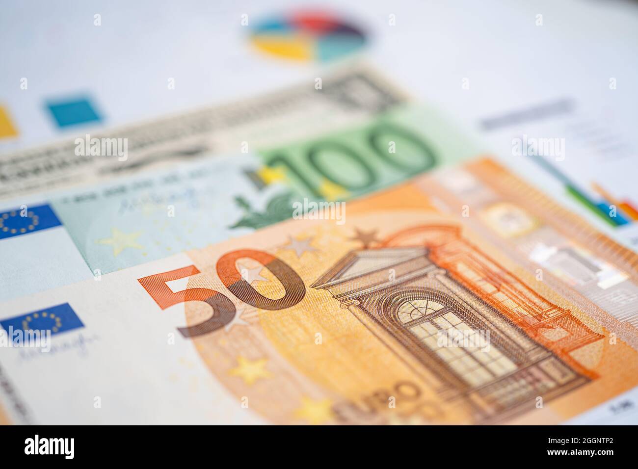 Euro banknotes money on chart graph paper. Financial development ...