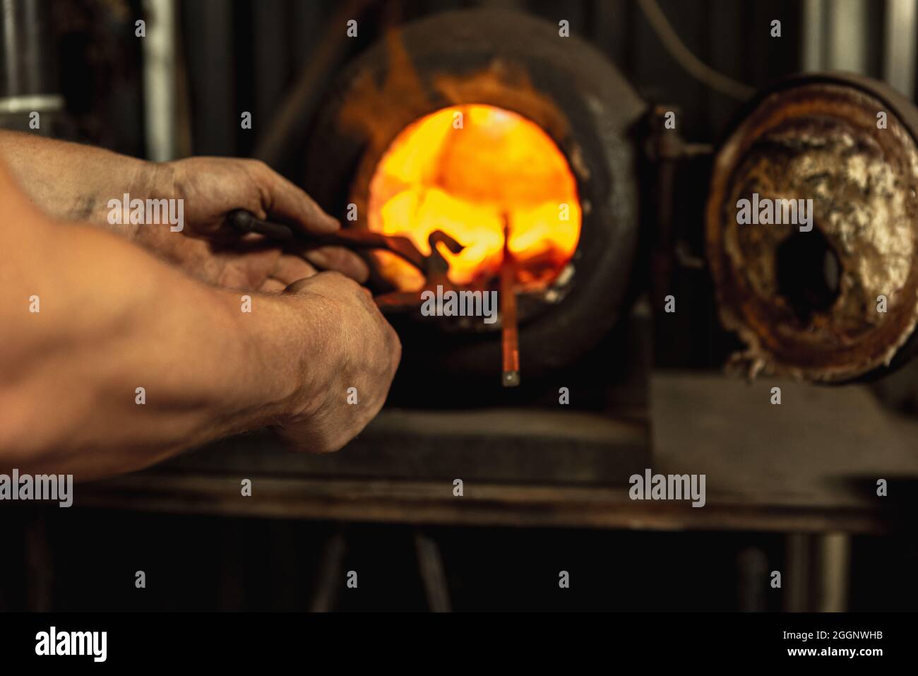 Blacksmith making sword in forge hi-res stock photography and images ...
