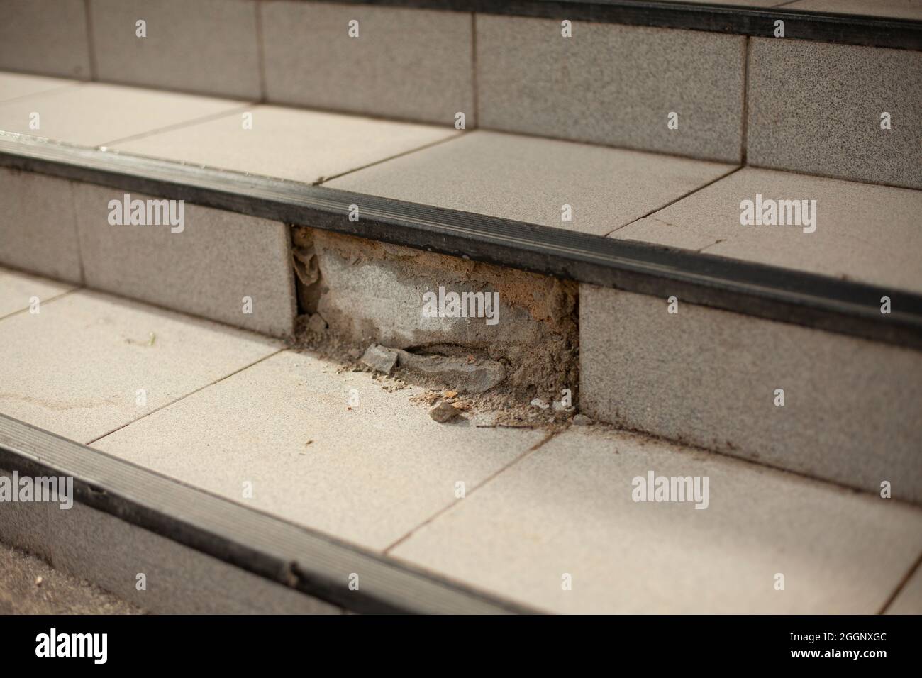 Destroyed facing of steps. Collapsed tiles. Renovation of the facade is ...
