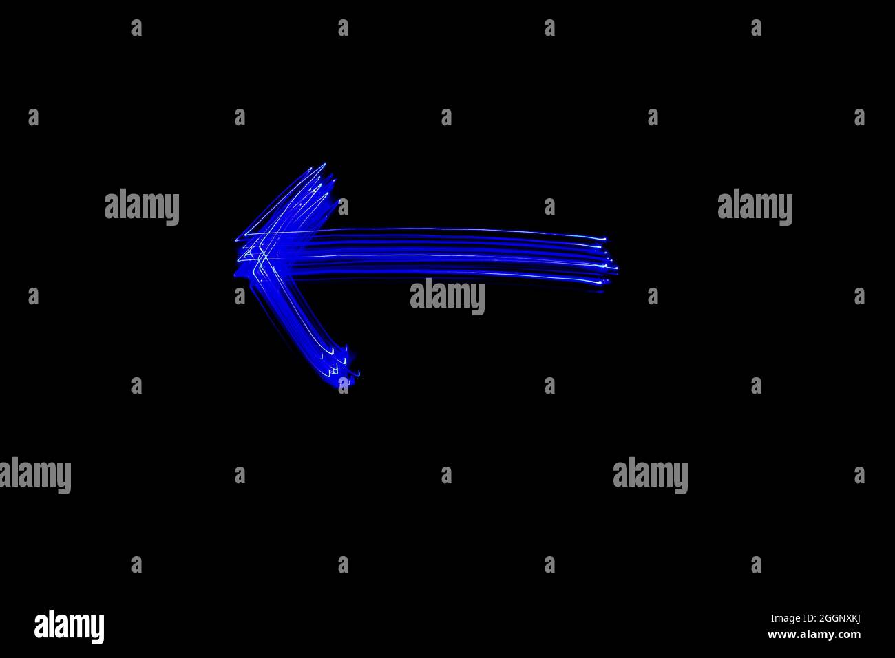 Light painting arrow sign. Drawn arrow shape with blue lights. Long ...