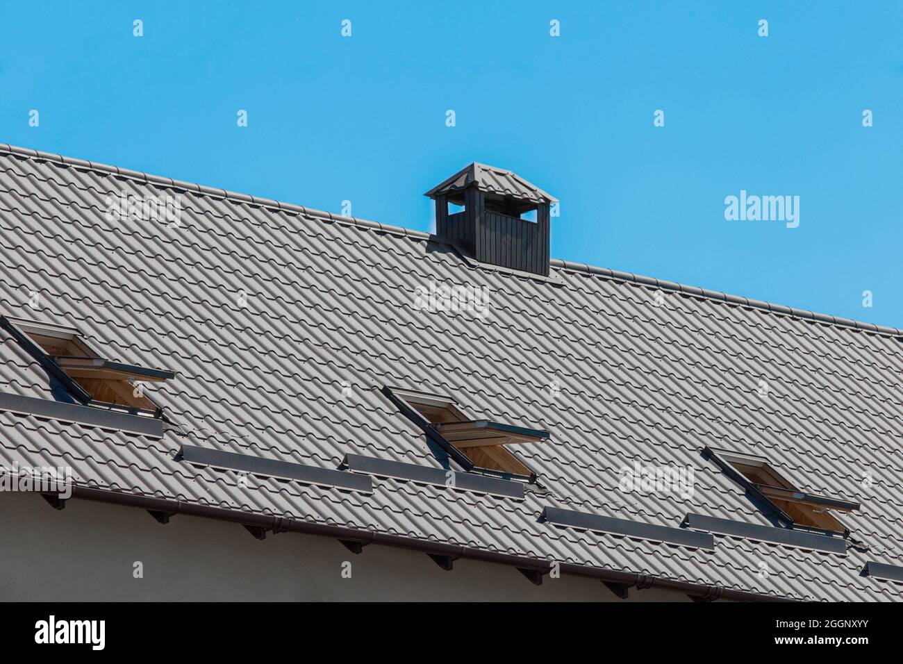 Modern design of the roof of the house with open windows architecture ...