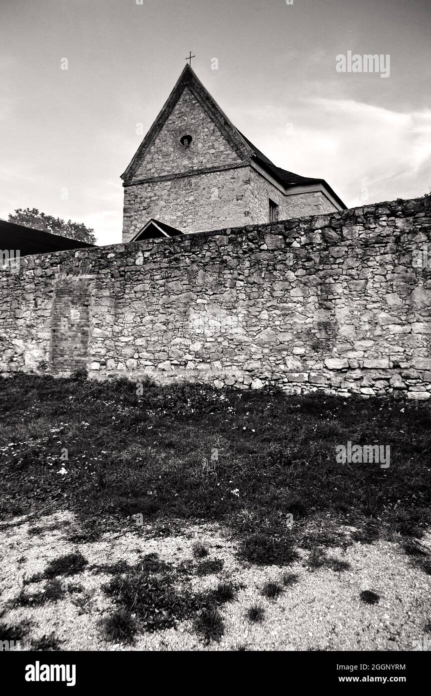 Medieval monastery with ancient stone wall, black and white photography ...
