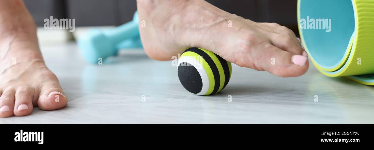 Massaging feet ball hi-res stock photography and images - Alamy