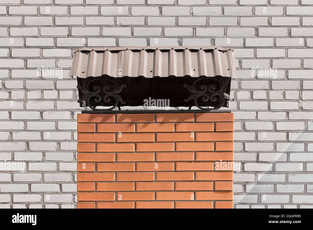 Red or brown brick architectural element on the background of white ...