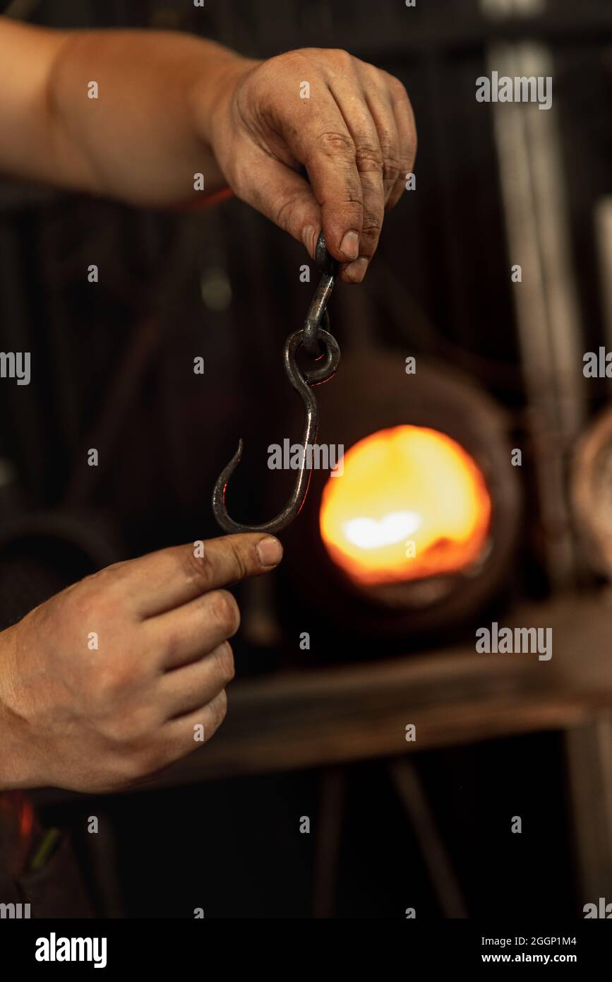 Blacksmith making sword in forge hi-res stock photography and images ...