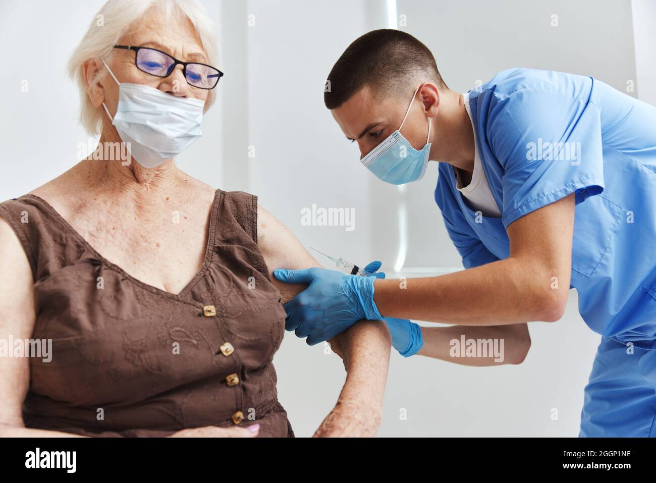 male doctor giving an injection immunization safety health care Stock ...