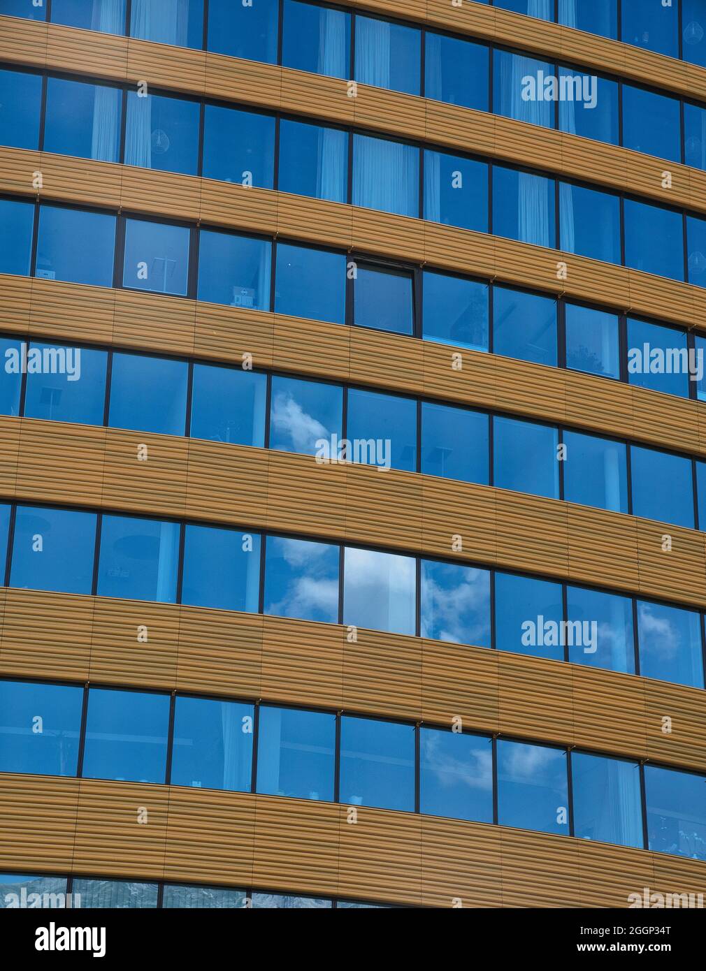 Vertical shot of the exterior of a tall modern building with a lot of ...