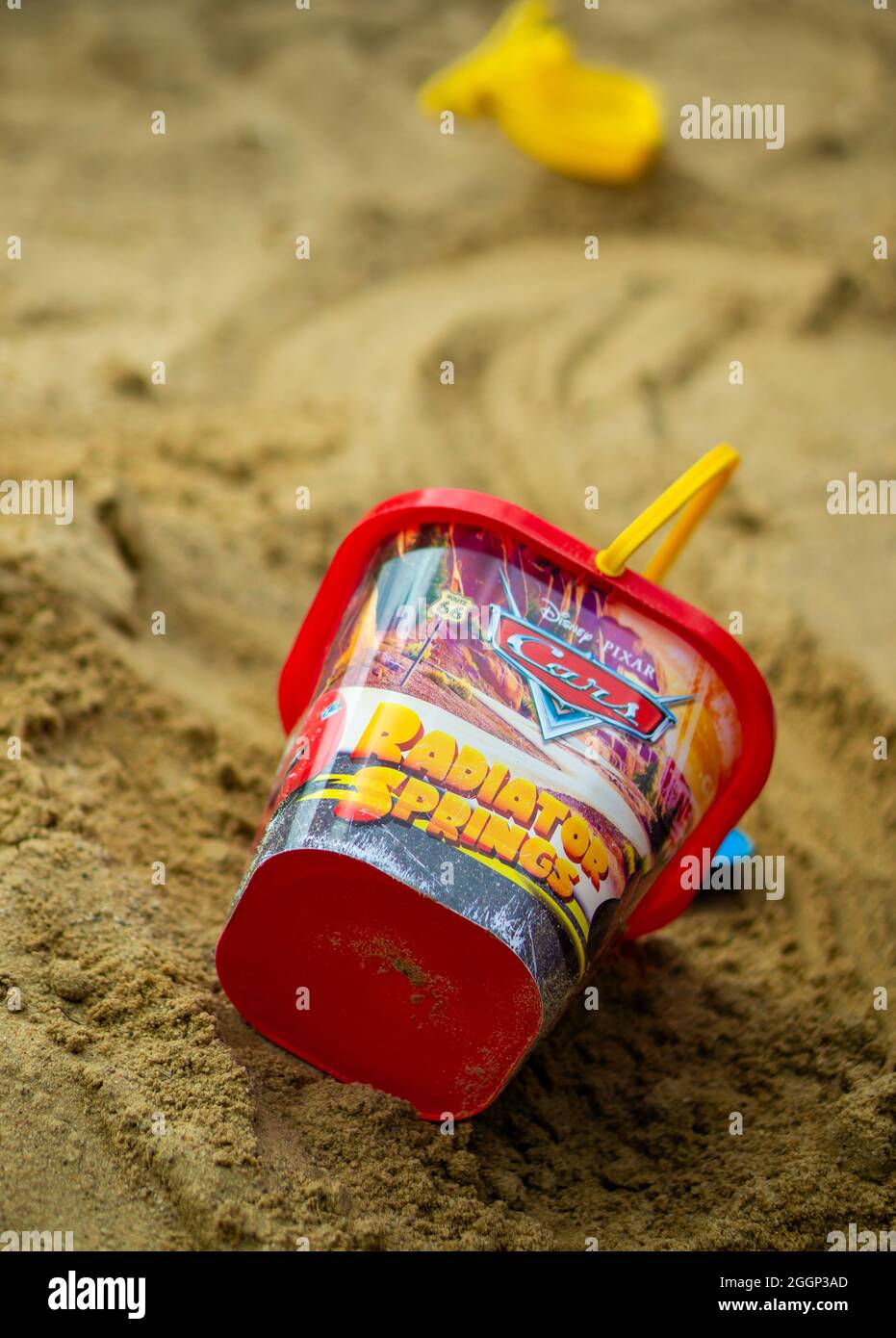 POZNAN, POLAND - Aug 25, 2018: The plastic red toy bucket on the sand ...