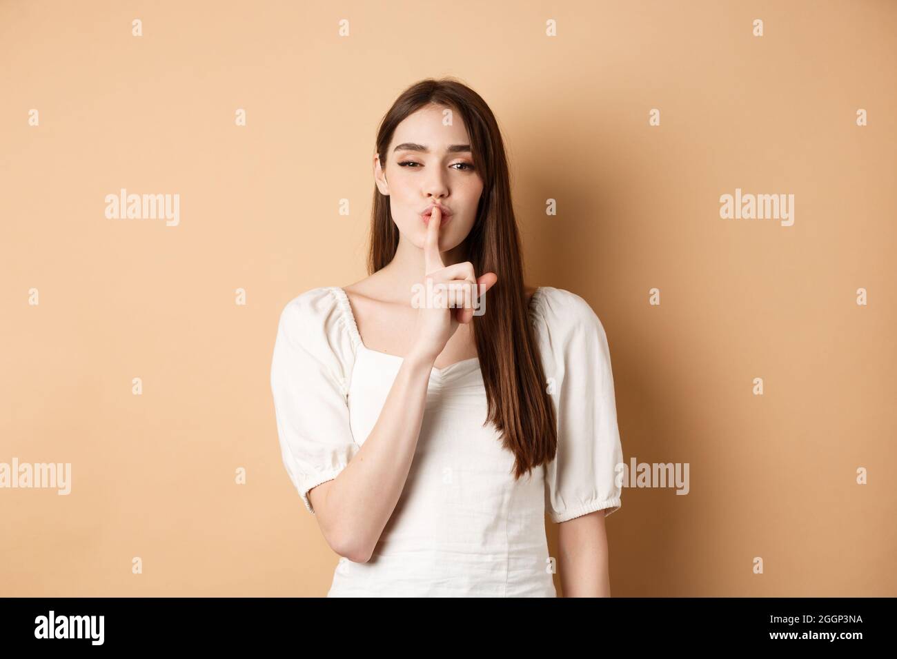 Sensual cute girl hiding secret, showing hush gesture, make shhh sound ...
