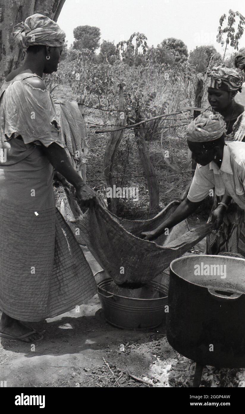 Women placing a cloth over a small bowl Stock Photo - Alamy