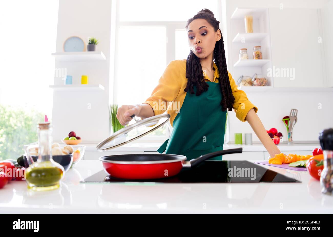 Photo of shiny pretty dark skin lady wear yellow shirt cooking opening ...