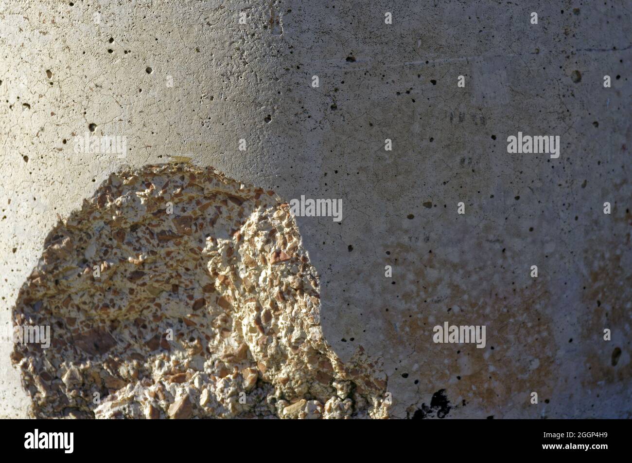 Close up of a dirty grunge old rusty white wall with smashed part under ...